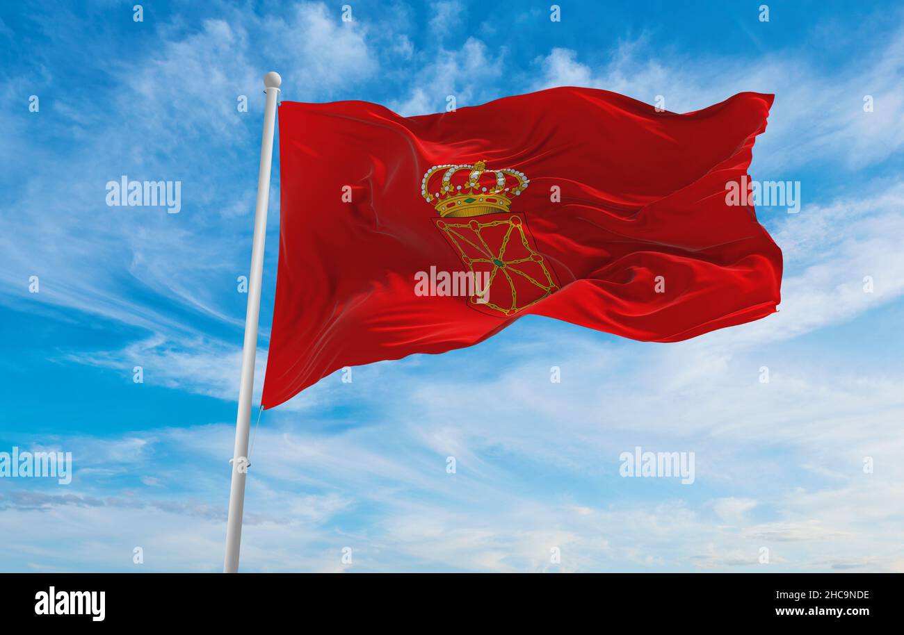 flag of Navarra , Spain at cloudy sky background on sunset, panoramic ...