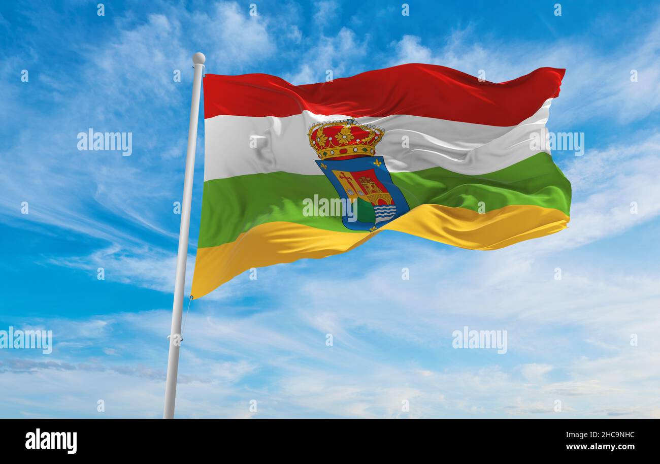 flag of Rioja with coat of arms , Spain at cloudy sky background on ...