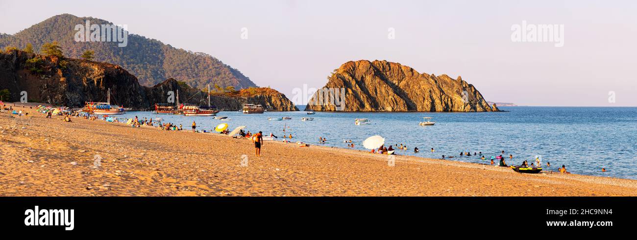 29 August 2021, Cirali, Turkey: Panoramic view of vacationers sunbathe ...