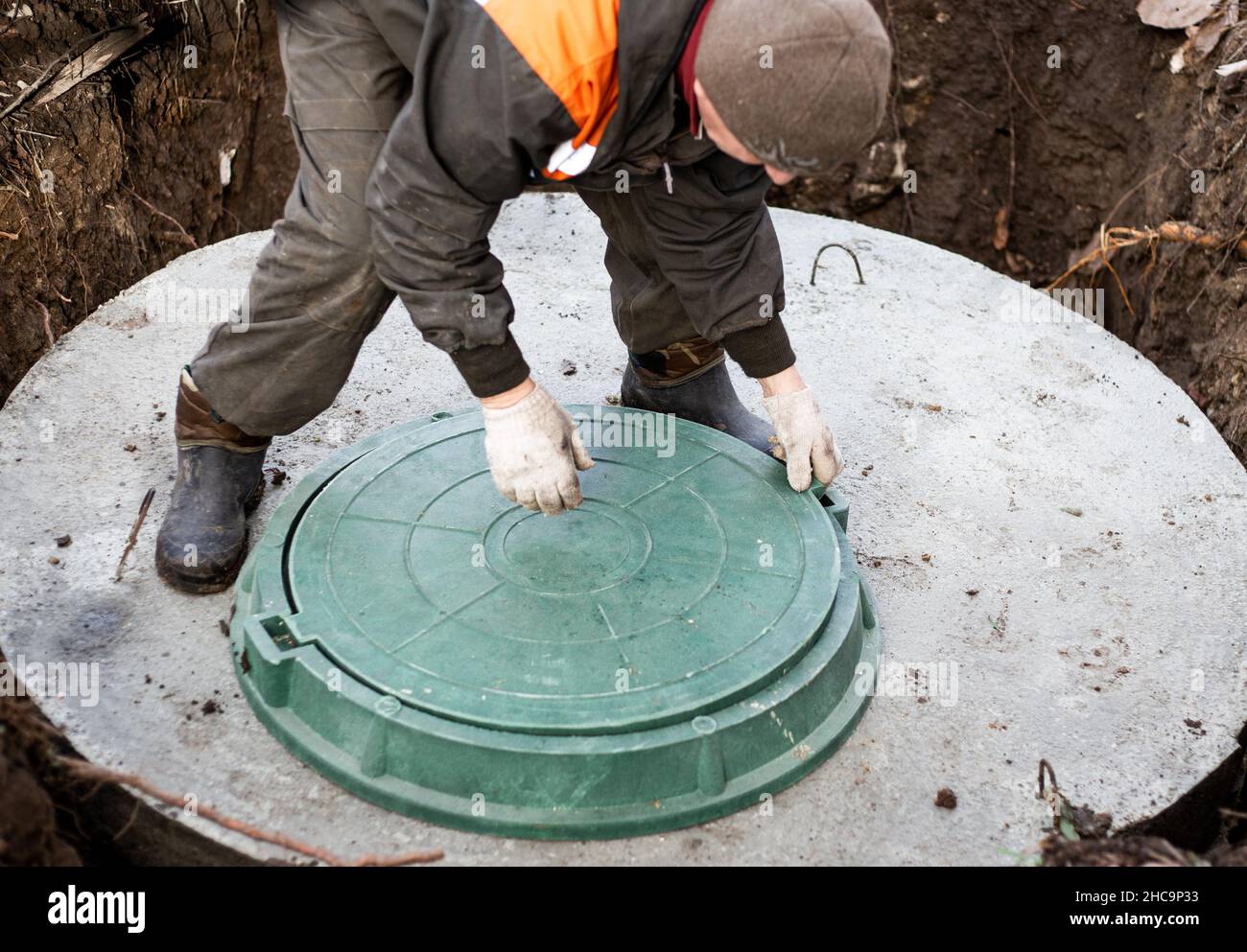 Manhole and house hi-res stock photography and images - Alamy