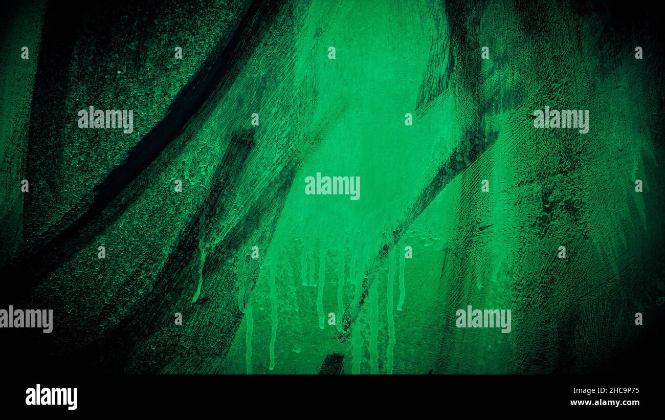 Splashes of acrylic paints on the wall, black and green combination ...