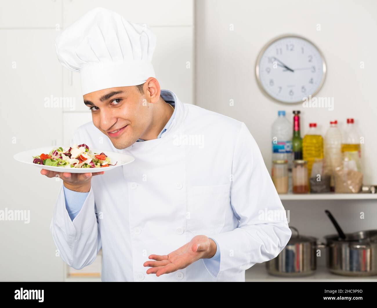 Man is evaluating prepared dish Stock Photo - Alamy