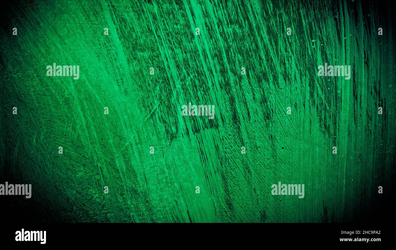 Splashes of acrylic paints on the wall, black and green combination ...