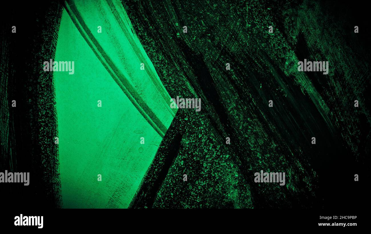 Splashes of acrylic paints on the wall, black and green combination ...