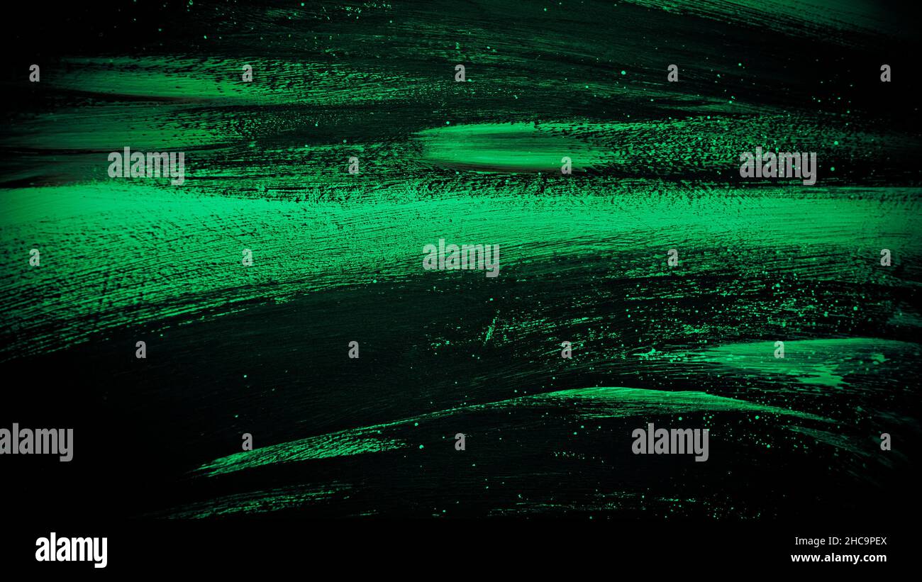 Splashes of acrylic paints on the wall, black and green combination ...