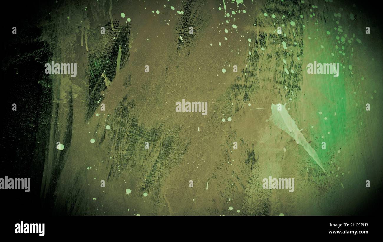 Splashes of acrylic paints on the wall, black and green combination ...