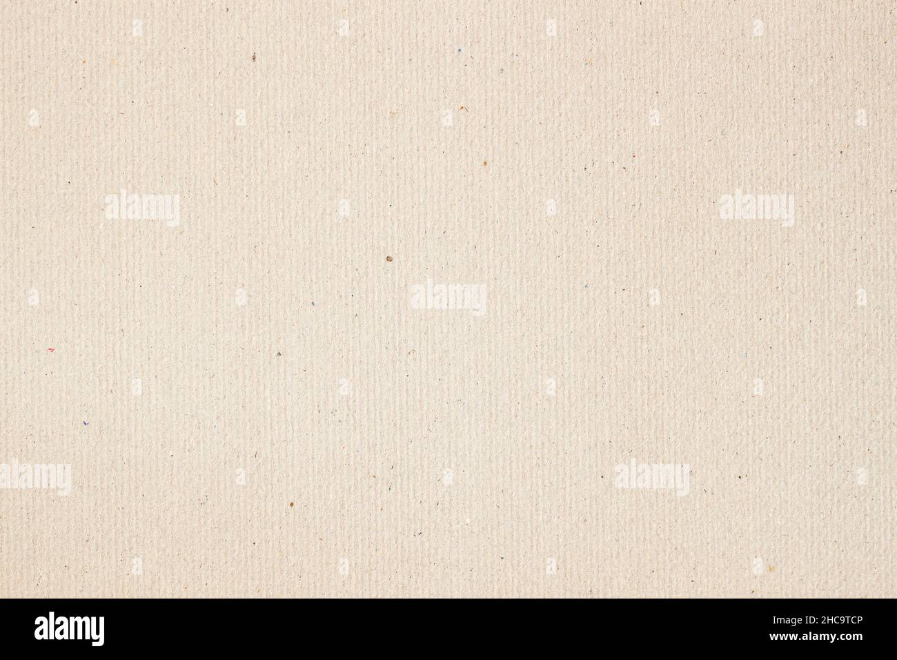 Texture craft striped paper close-up with small inclusions. For ...