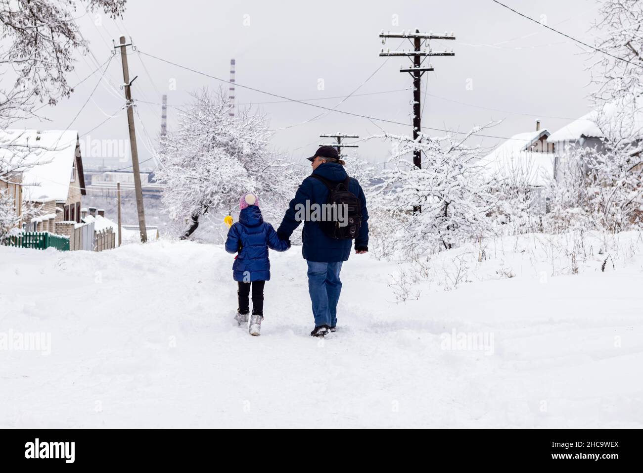 Child parent fun snow winter cold hi-res stock photography and images ...