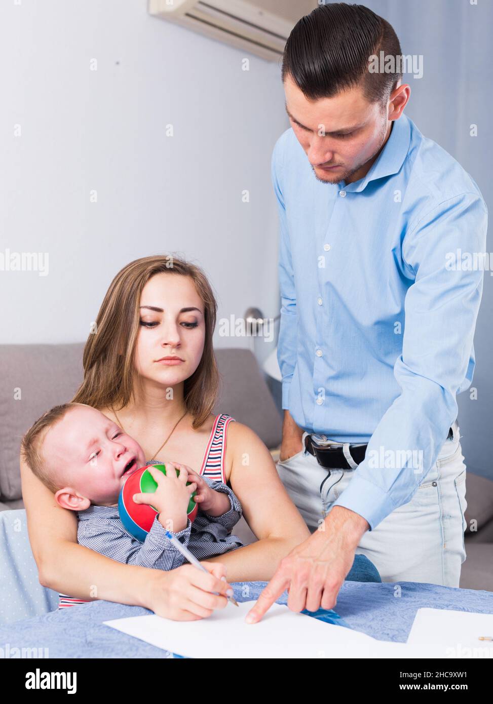 Son and father signing documents hi-res stock photography and images ...
