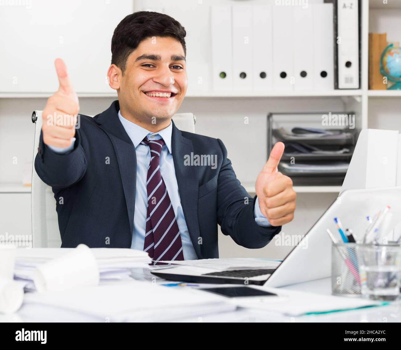 Male employee is having productive day at work Stock Photo - Alamy