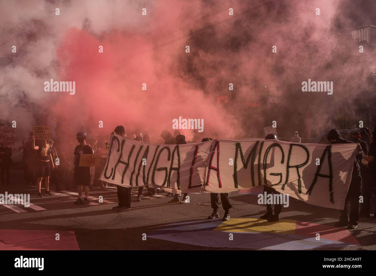 Seattle, USA. 25th Sep, 2021. Late in the day protestors setting off ...