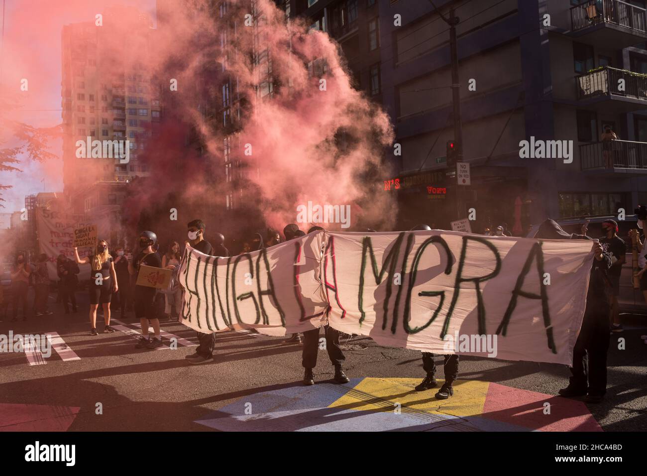 Seattle, USA. 25th Sep, 2021. Late in the day protestors setting off ...