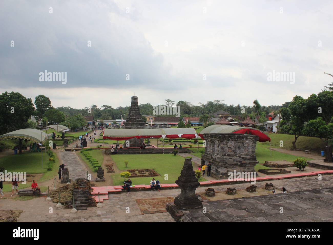 reliefs of traditional statues and buildings at the Penataran Temple in ...