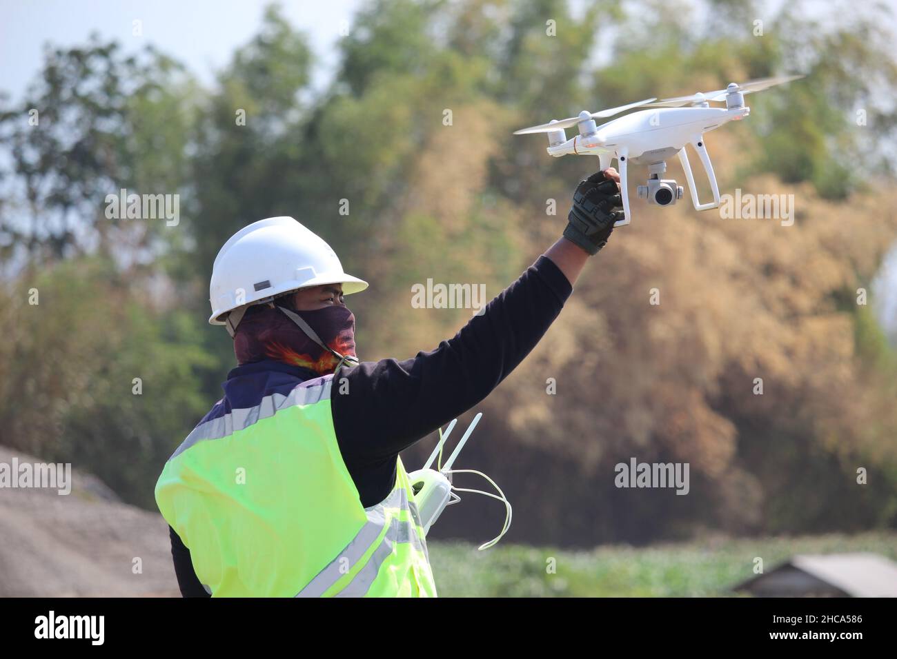 drone operator flying his drone to record the atmosphere at work Stock ...