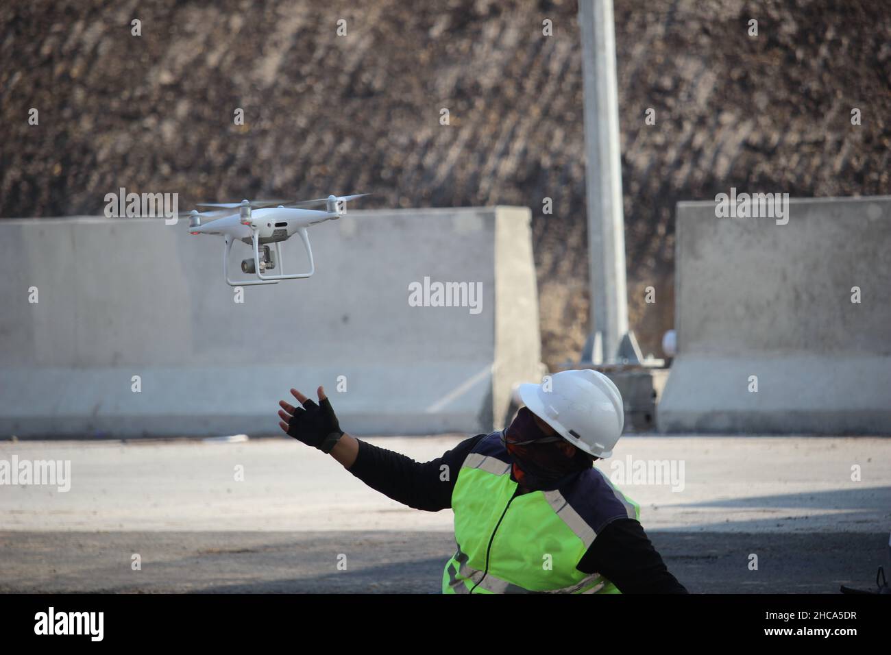 drone operator flying his drone to record the atmosphere at work Stock ...