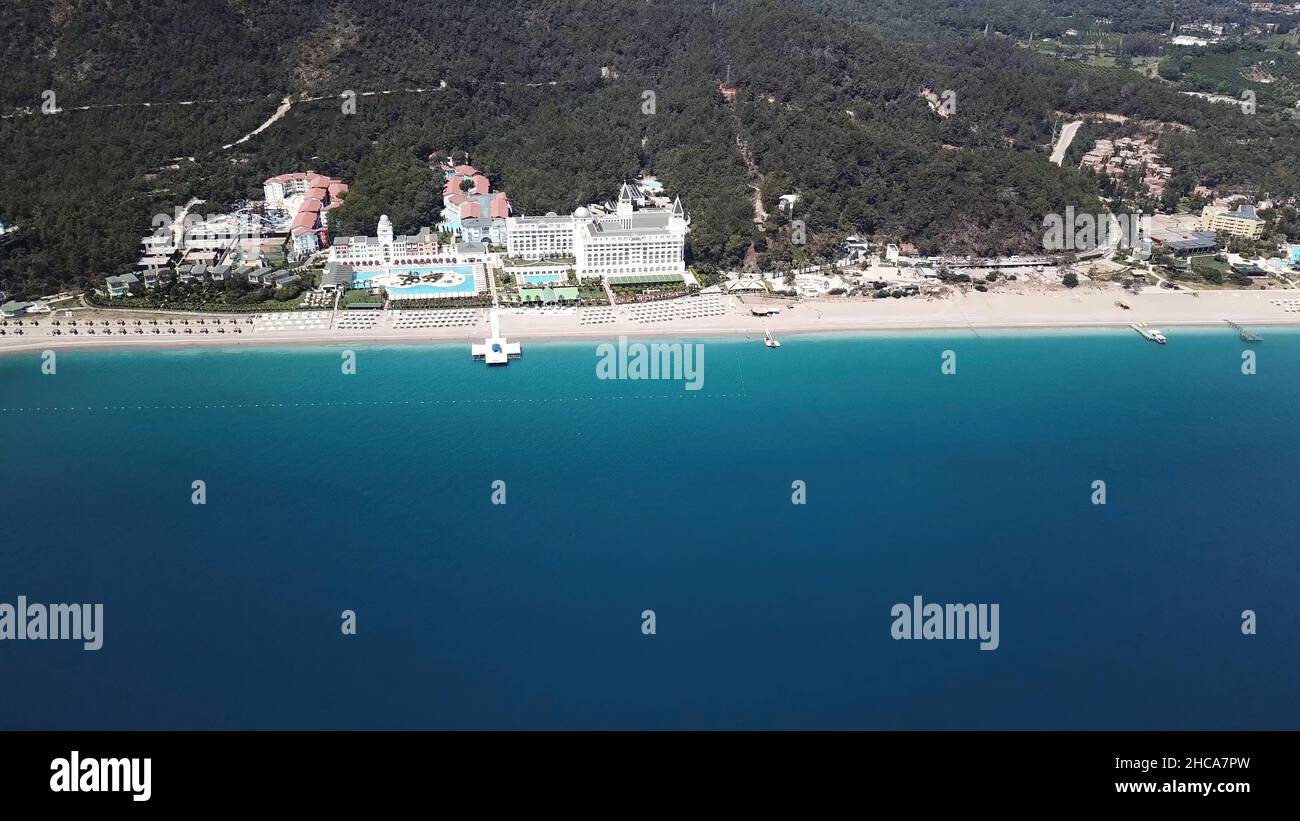 Hotel Poolside with Parasols and Palms. Clip. Top view shot. Swimming ...
