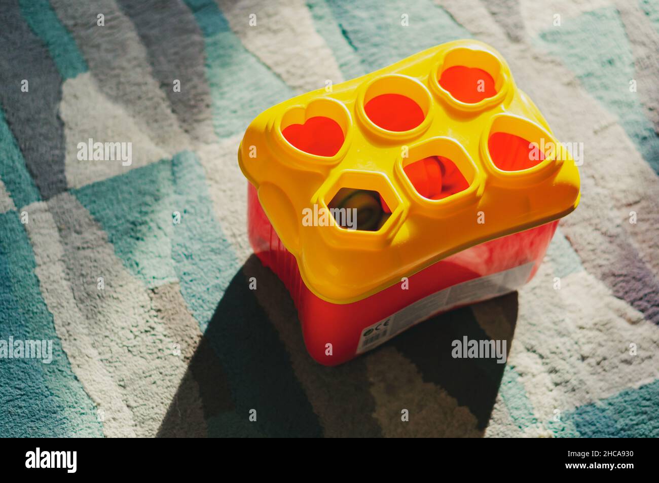 Closeup of a toy sorter on a ground Stock Photo - Alamy