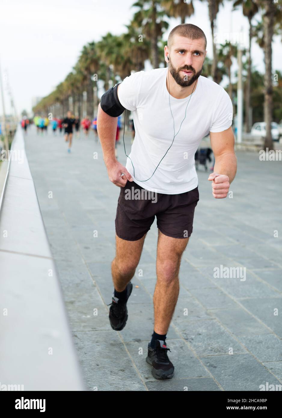 Muscle man running jogging road hi-res stock photography and images - Alamy