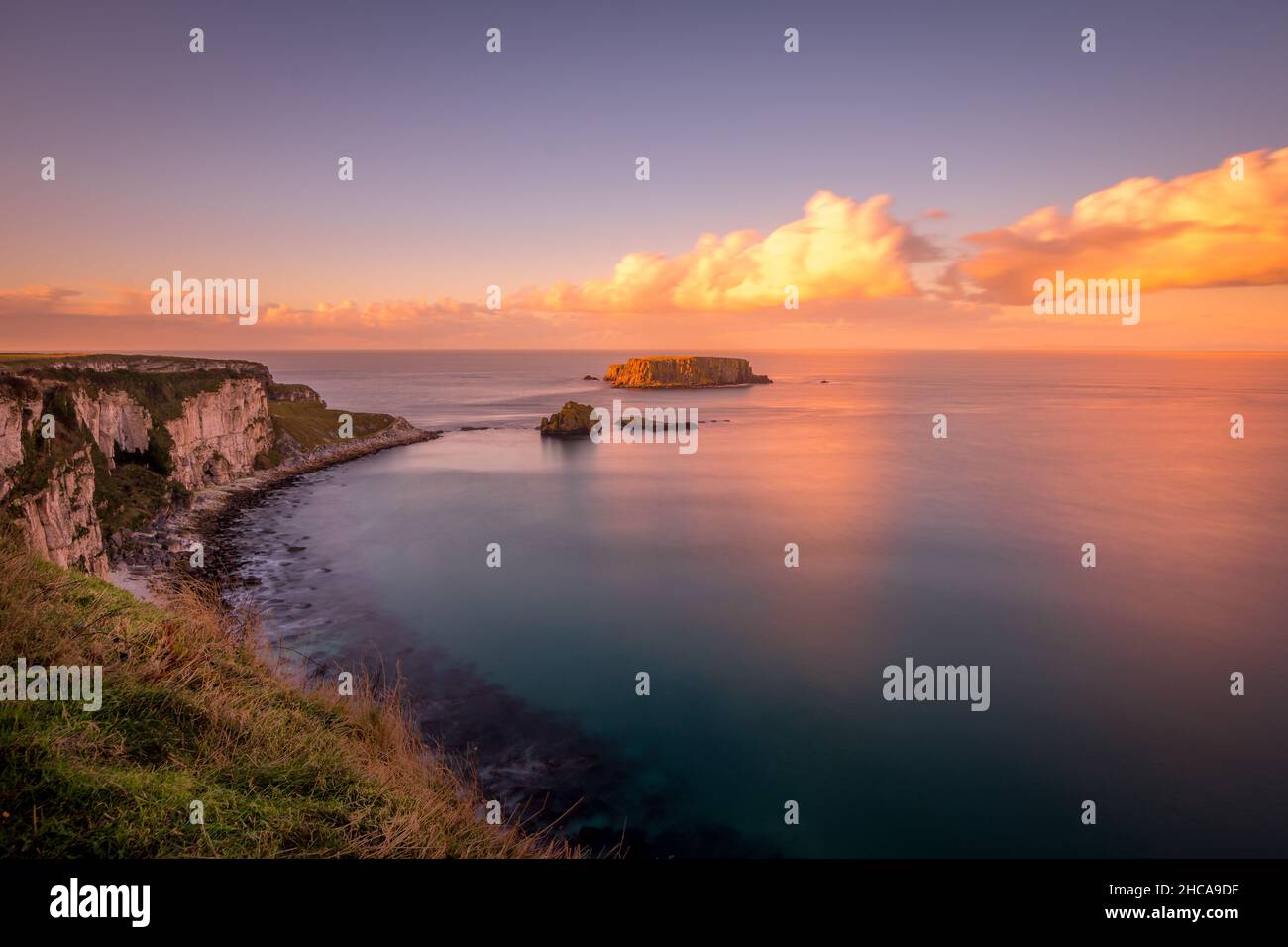 Landscape of the Giant's Causeway surrounded by the sea with long ...