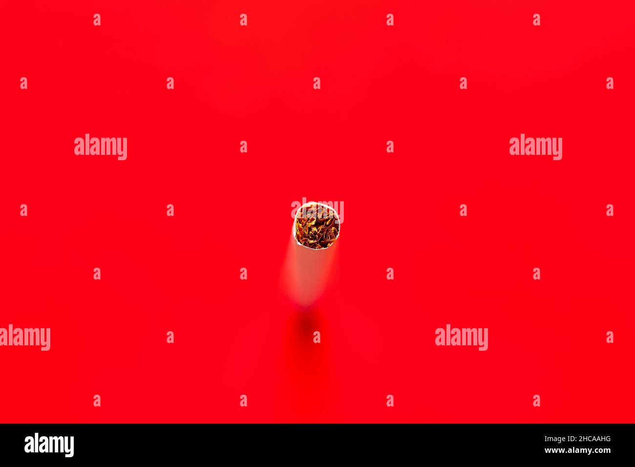 Single cigarette macro in selective focus , at red background Stock ...