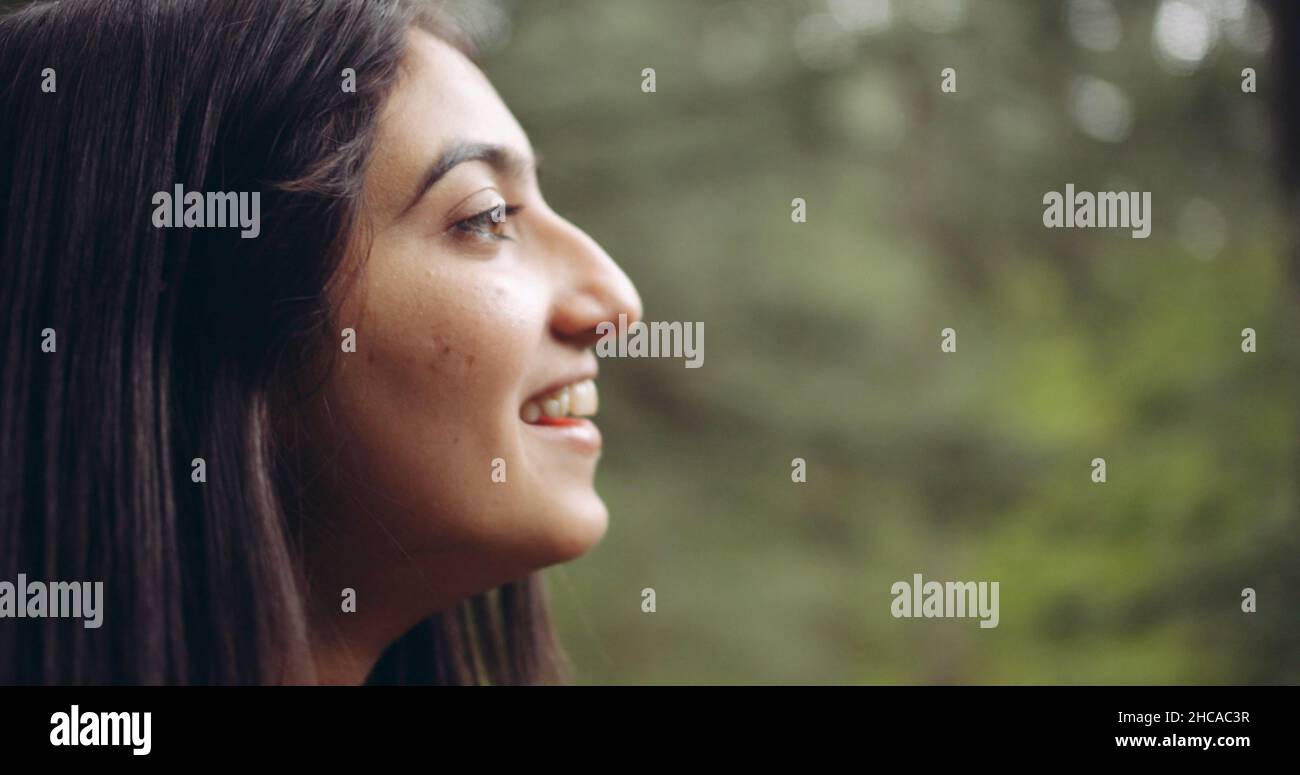 Closeup portrait of an Indian female laughing looking forward with ...
