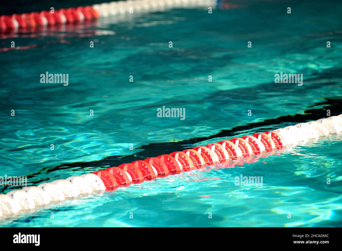 Close-up shot of red and white swimming pool lane divider Stock Photo ...