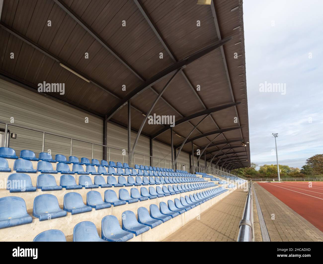 Football stadium arena with blue seats Stock Photo - Alamy