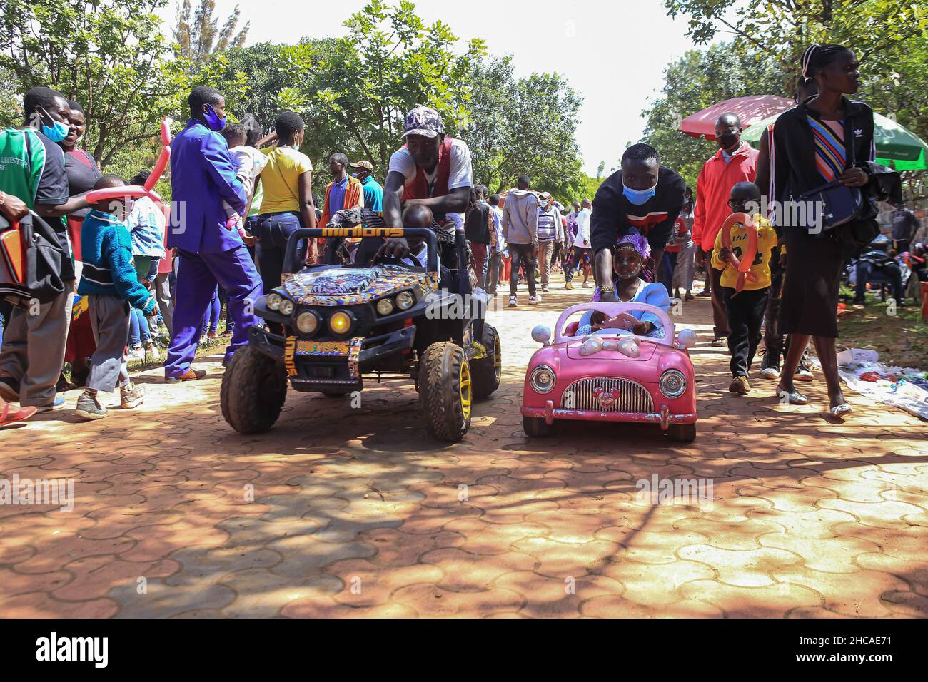 Nairobi, Kenya. 25th Dec, 2021. Kenyan children enjoying rides on toy ...