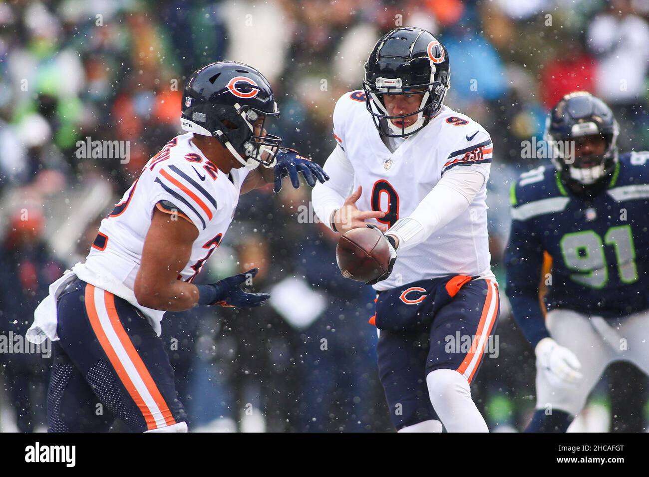 December 26, 2021: Chicago Bears quarteback Nick Foles (9) hands the ball off to Chicago Bears ...