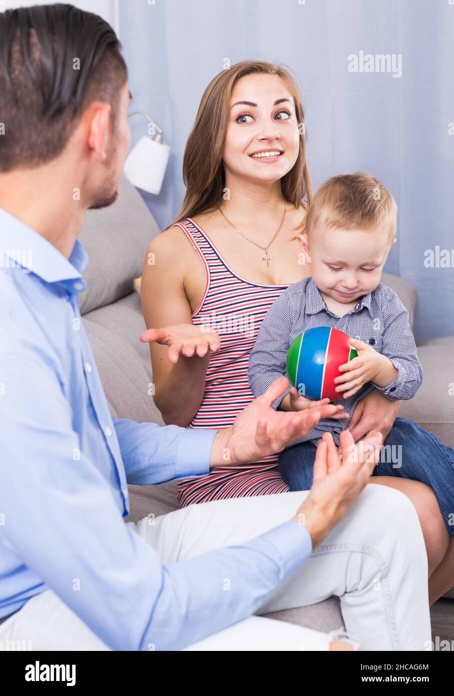 Portrait of glad and happy family talking Stock Photo - Alamy