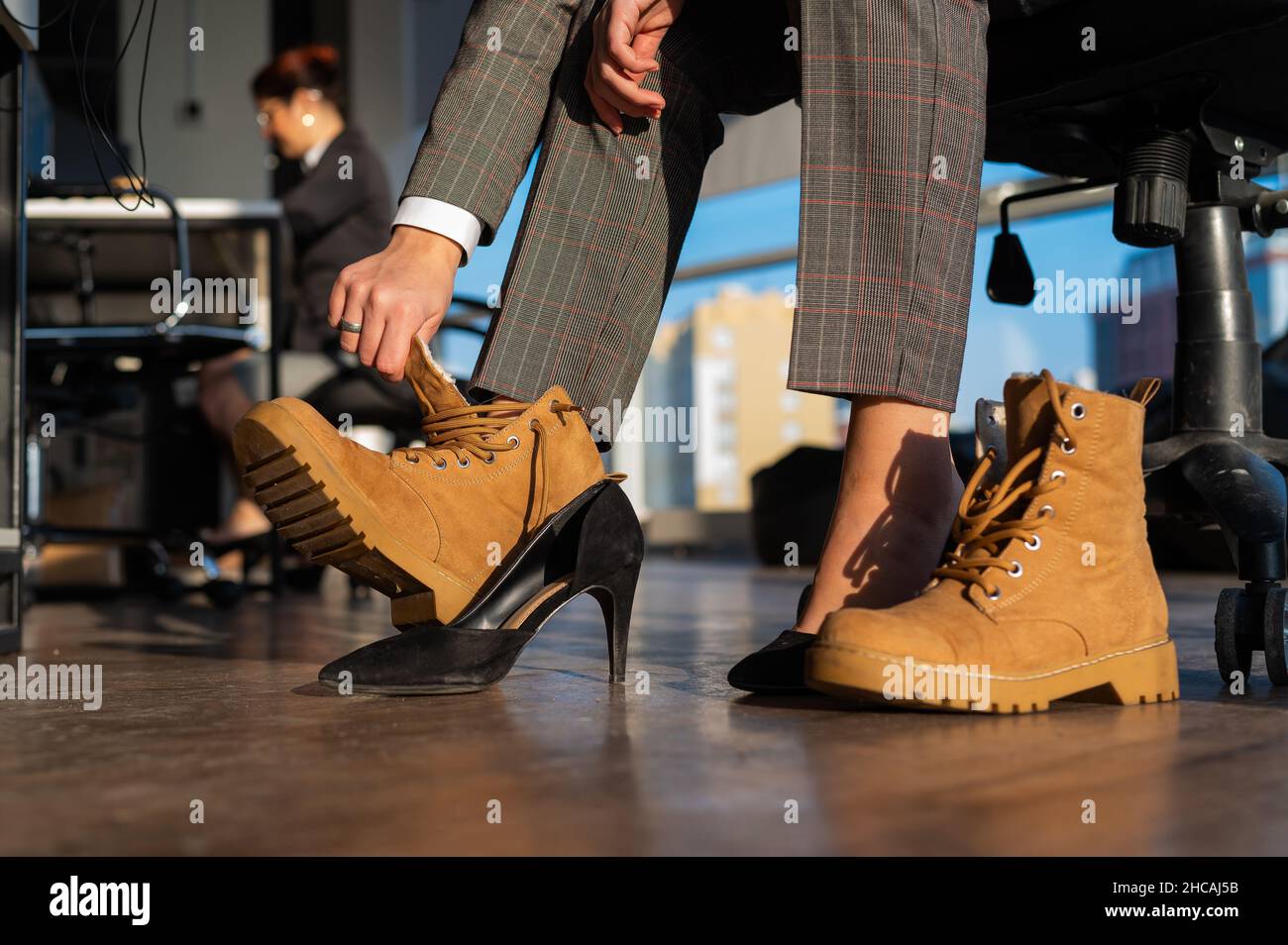 Woman removing boots hi-res stock photography and images - Alamy