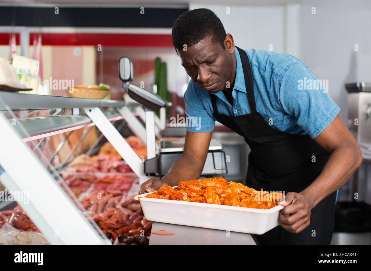 African american butcher preparing hi-res stock photography and images ...