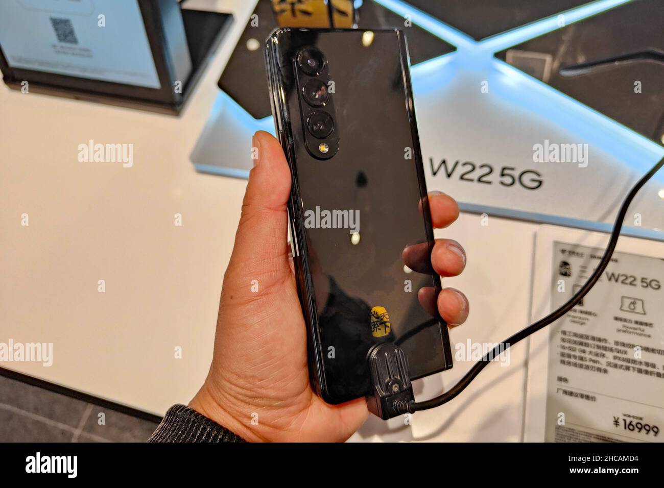 SHANGHAI, CHINA - DECEMBER 16, 2021 - A Samsung W22 5G phone is ...