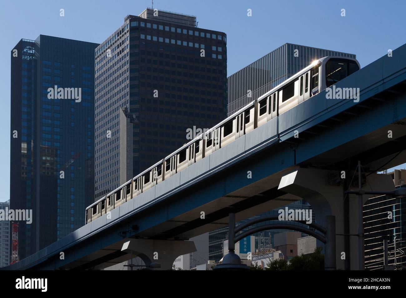 A Yurikamome Line train among Shiodome skyscrapers, Shimbashi, Tokyo ...