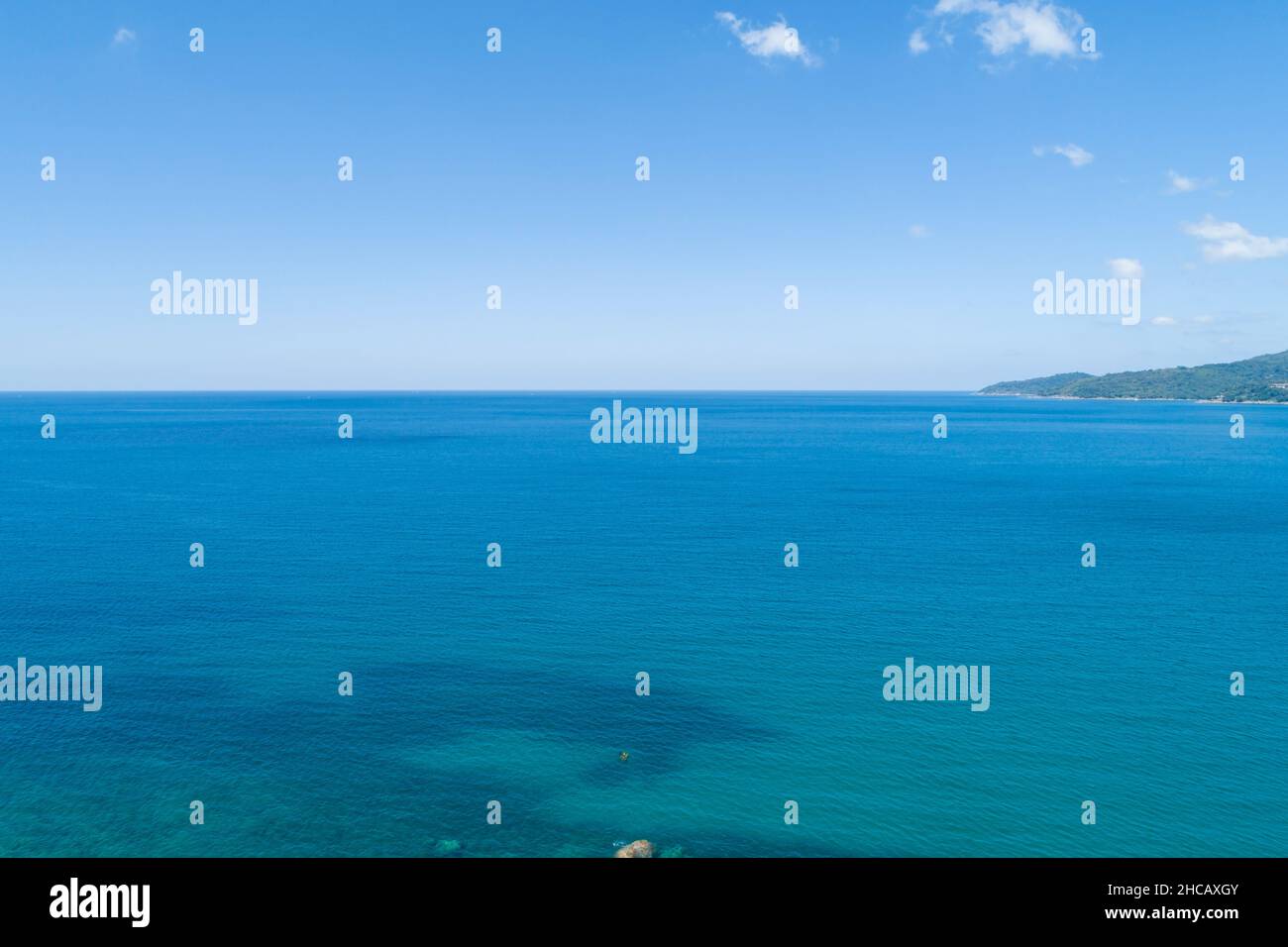 Aerial view of a blue sea surface water texture background and sun ...