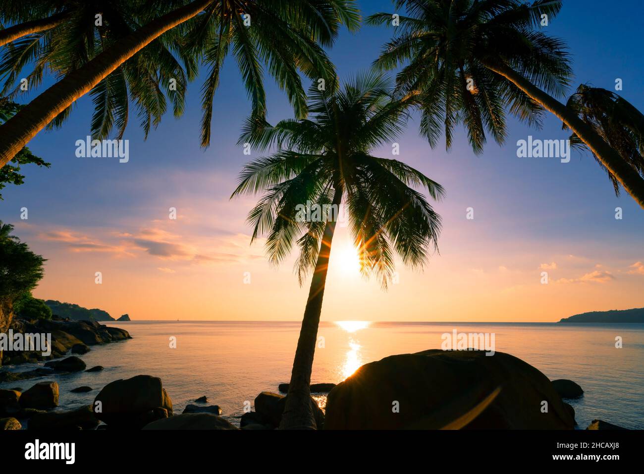 Long exposure image of Dramatic sky seascape with rock in sunset ...