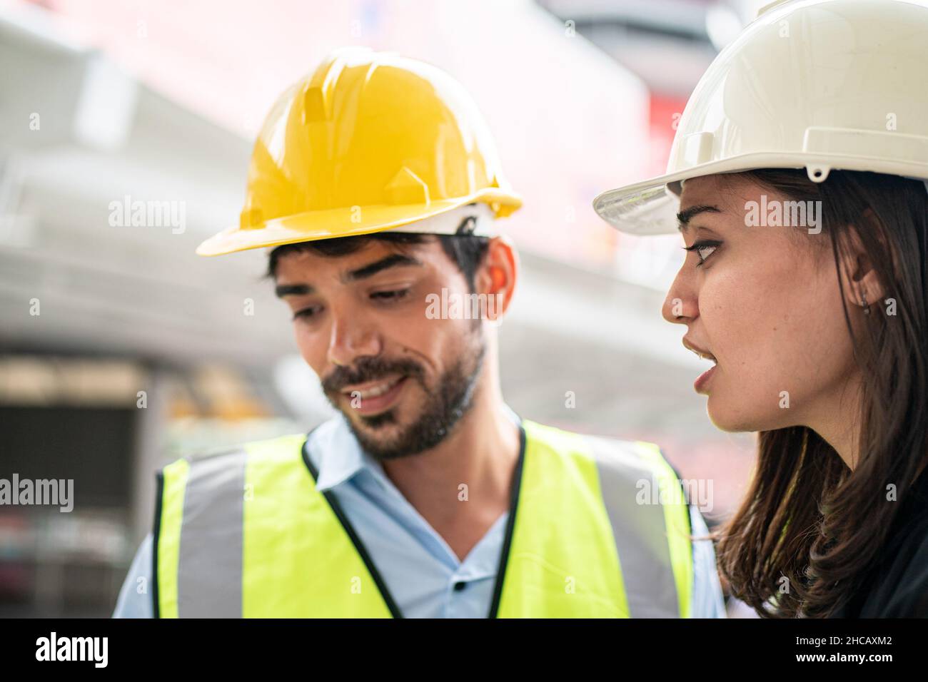 portrait of an industrial man and woman engineer with tablet in a ...