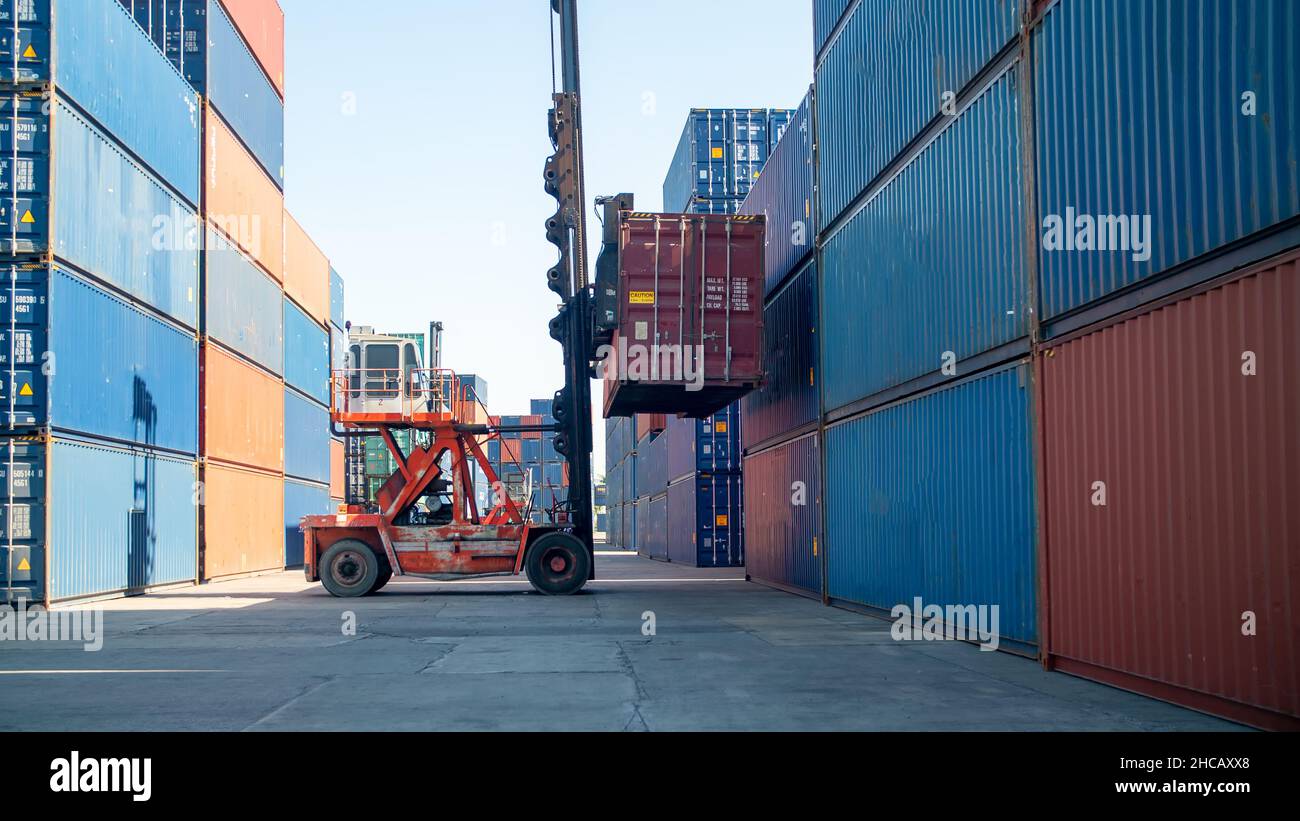 Containers loading on harbor port Stock Photo - Alamy