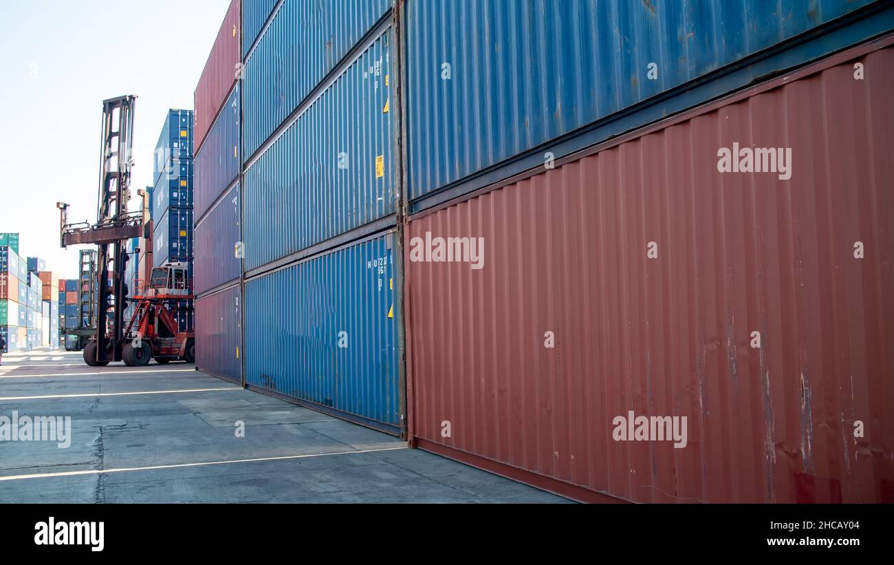 Containers loading on harbor port Stock Photo - Alamy