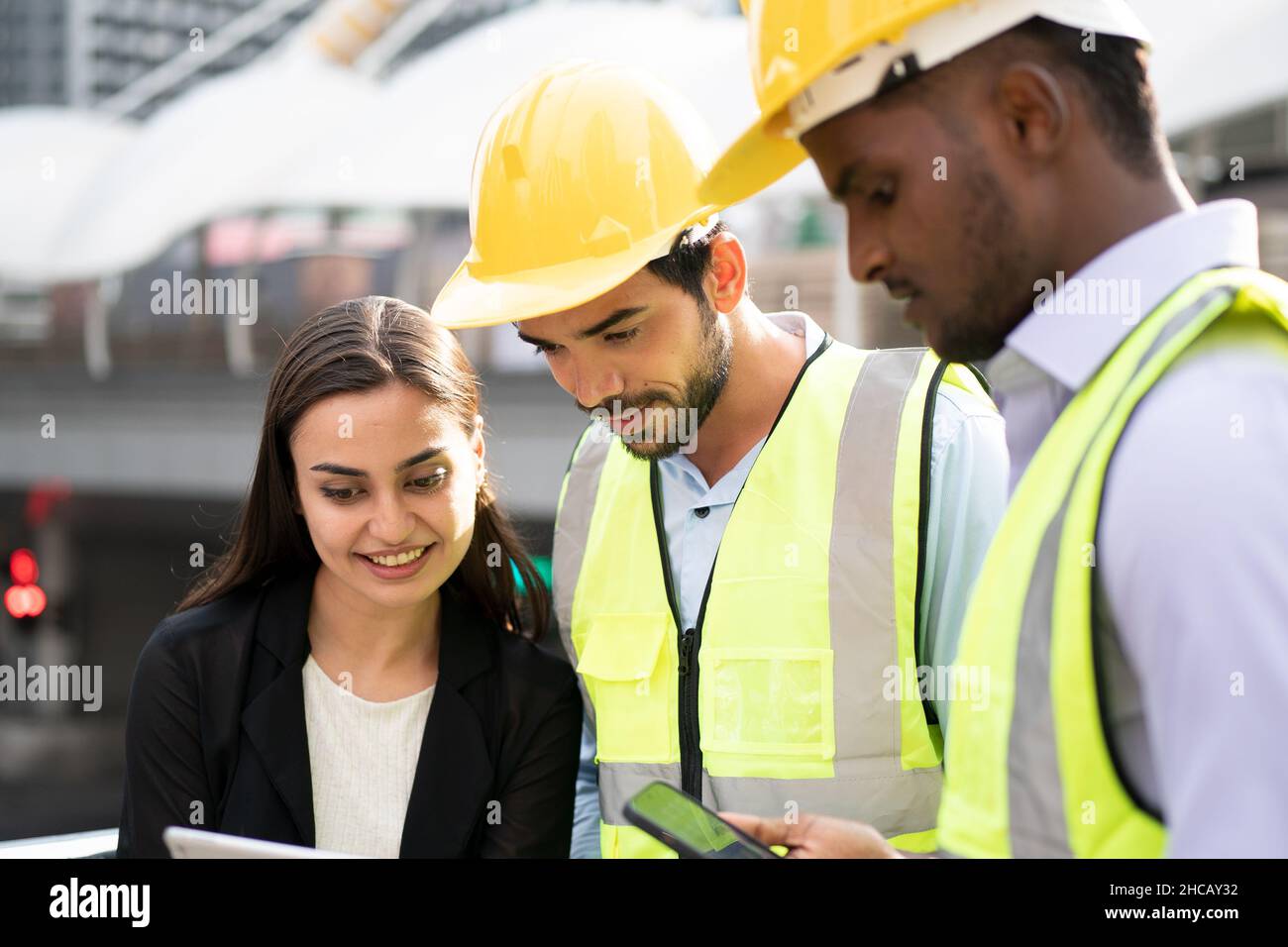 portrait of an industrial man and woman engineer with tablet in a ...