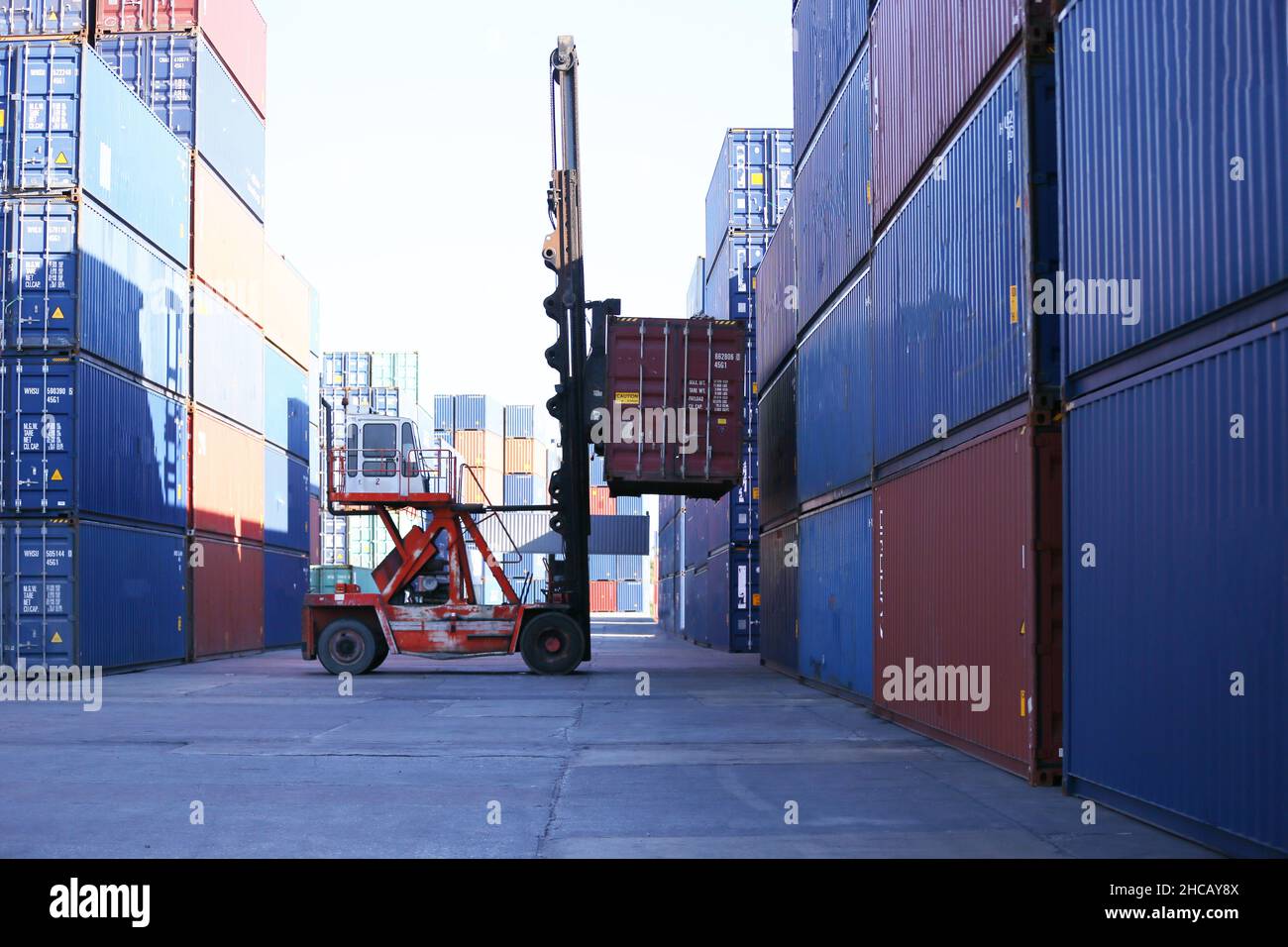 Containers loading on harbor port Stock Photo - Alamy