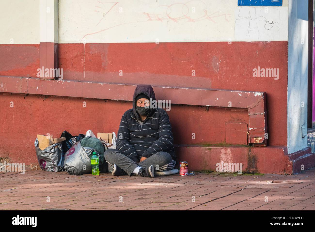 Homeless woman sitting on street hi-res stock photography and images ...