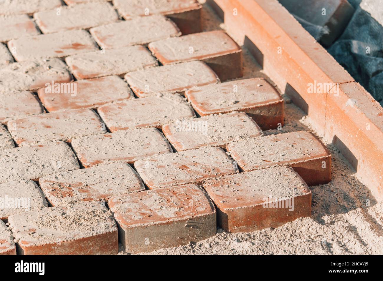 Brown concrete permeable flooring assembled on a substrate of sand ...