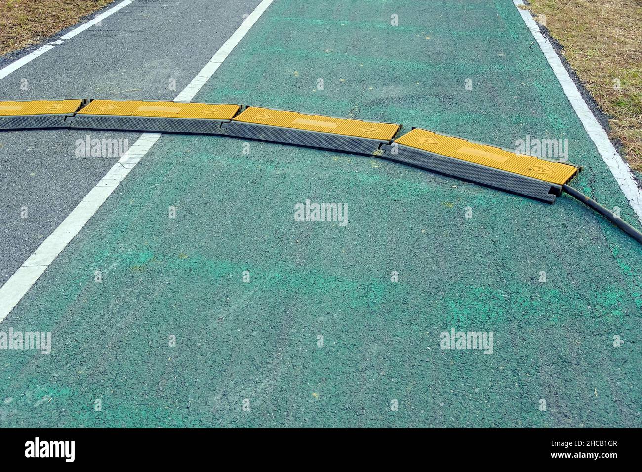 Black and yellow heavy plastic covers for people and vehicle to cross ...
