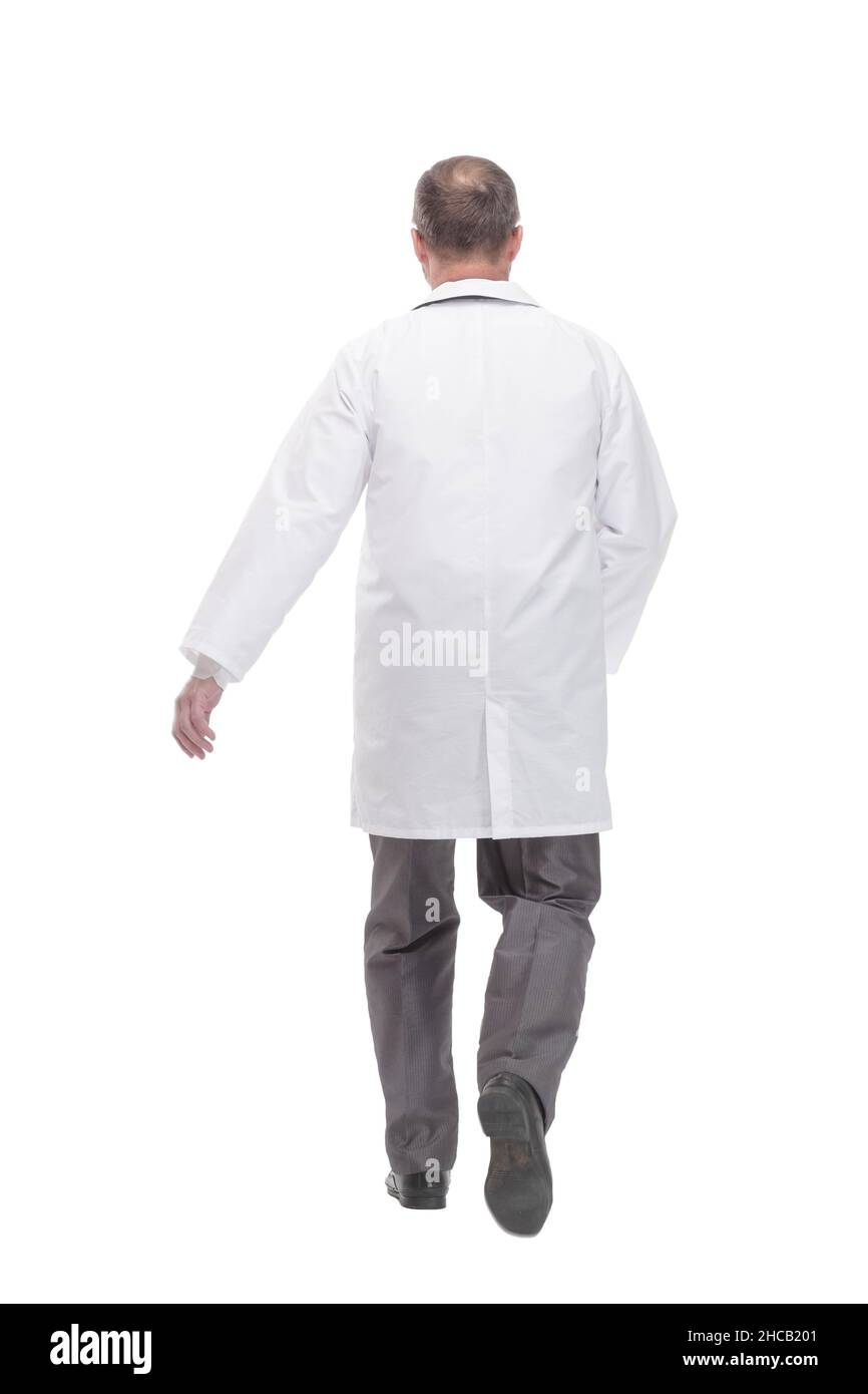 Mature male doctor striding forward. isolated on a white background ...