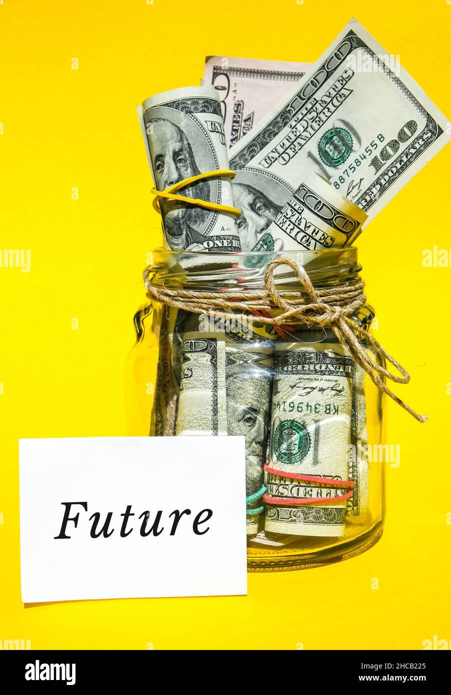 Glass jars filled with dollar bills, savings inside glass jar, money ...