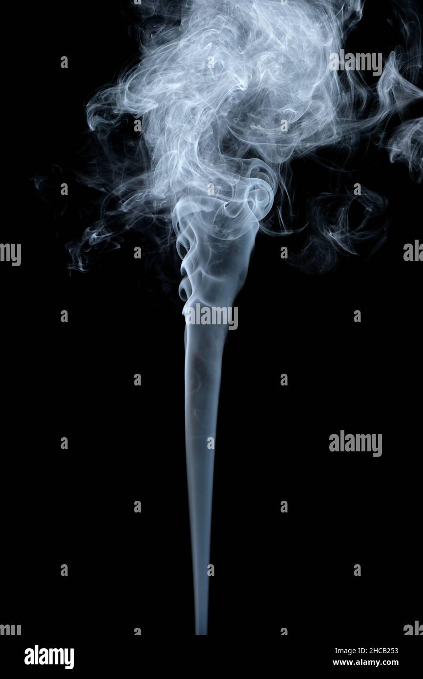 Clouds of curls of smoke on a black background Stock Photo - Alamy