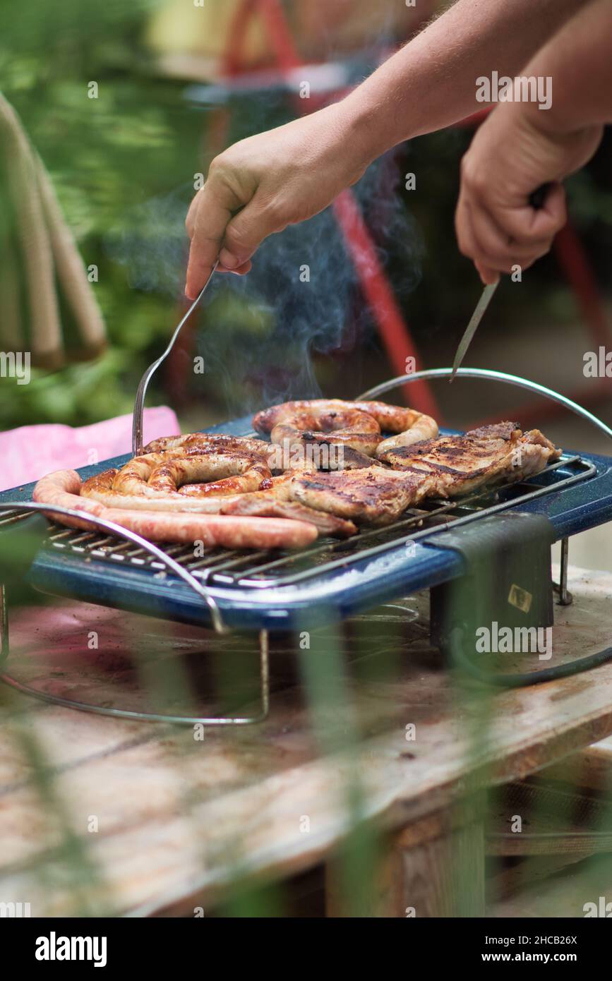 Person barbecue hi-res stock photography and images - Alamy