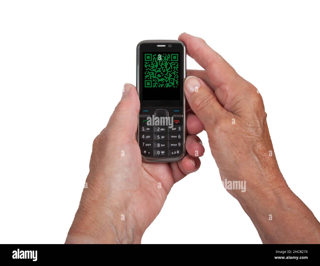 Hands of senior womanwith a mobile phone, isolated on white - QR-code ...