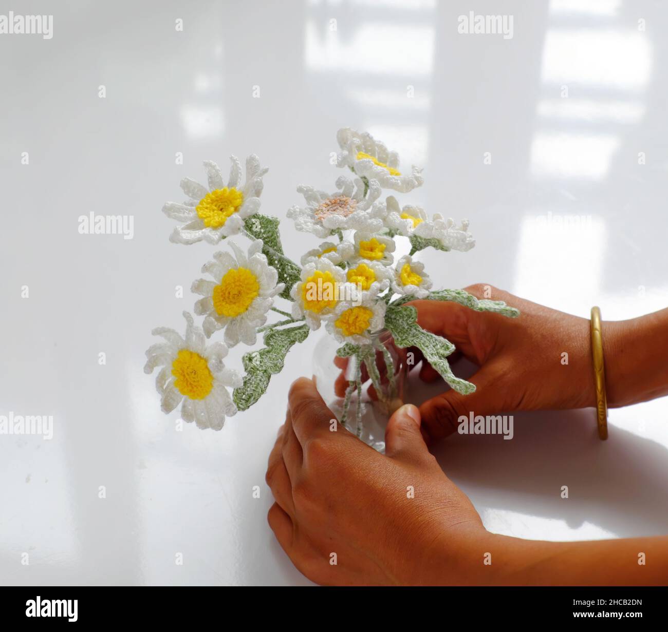 Woman hand hold handmade flower pot for home decor, white petal daisy ...